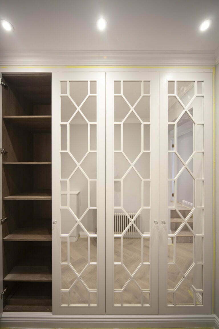 Prisma fitted mirrored wardrobes with lacquered fretwork doors London