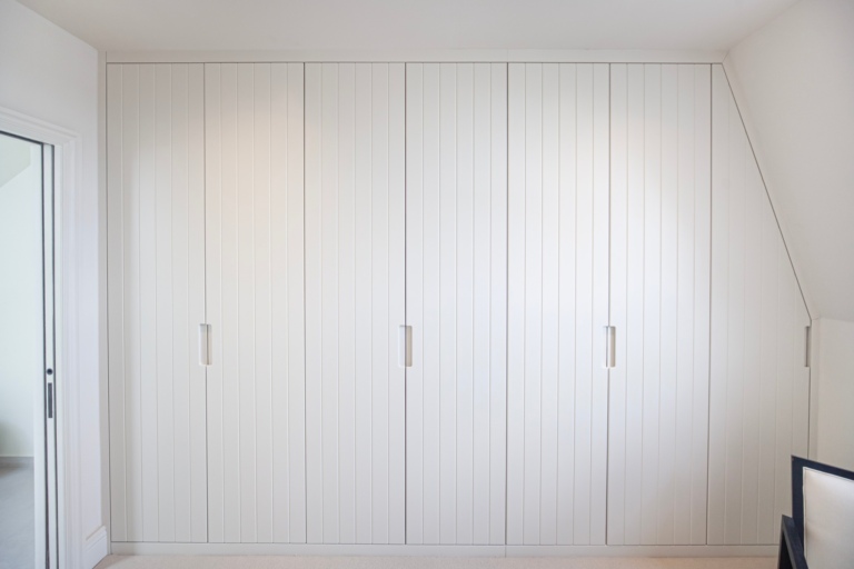 Built in loft room sloping ceiling wardrobe with tongue and groove MDF ...