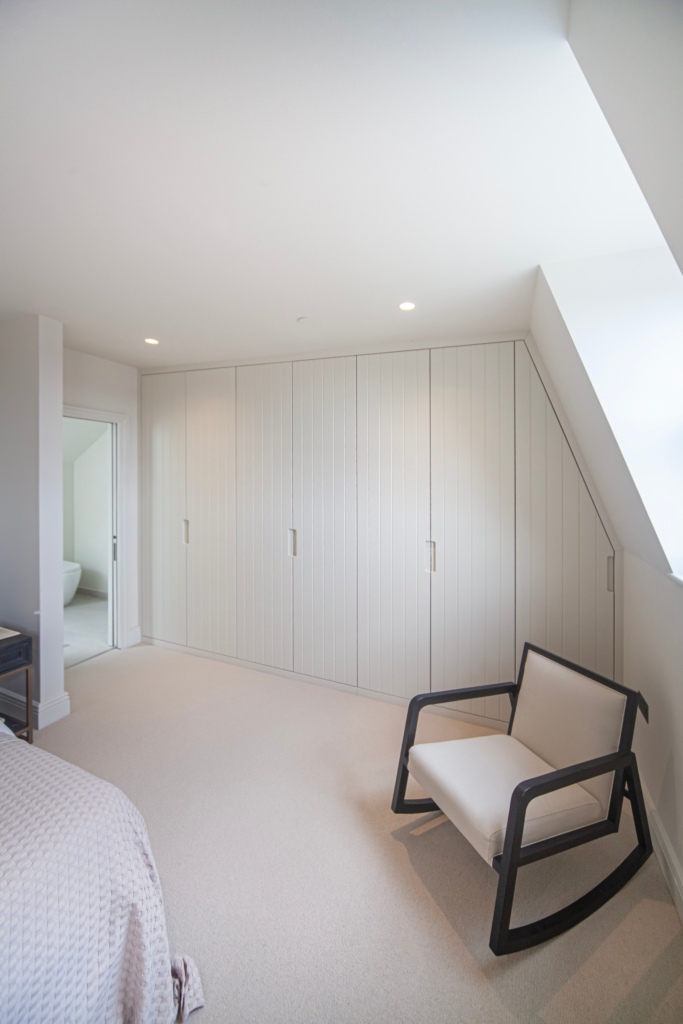 Built in loft room sloping ceiling wardrobe with tongue and groove MDF ...