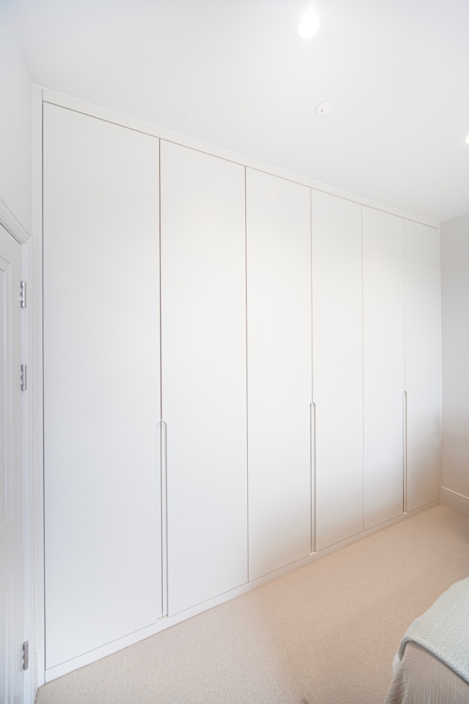 Made to measure fitted wardrobe with sprayed lacquered MDF doors and ...