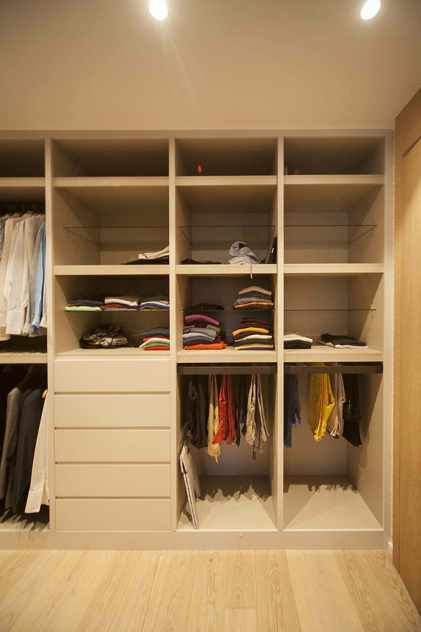 Walk in wardrobe with lacquered drawer fronts, bespoke dressing room London