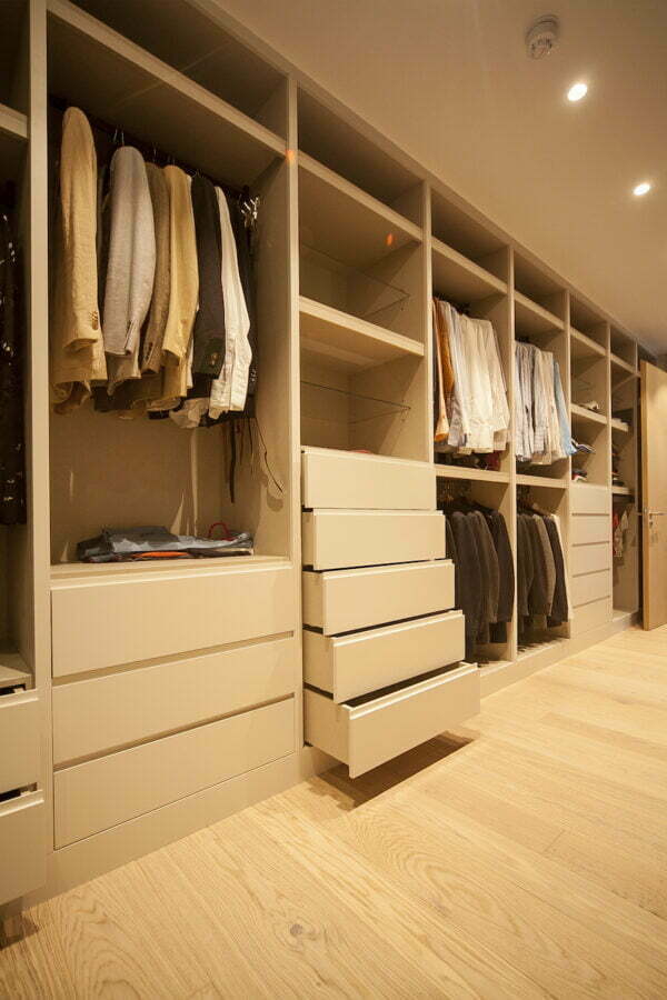 Walk in wardrobe with lacquered drawer fronts, bespoke dressing room London