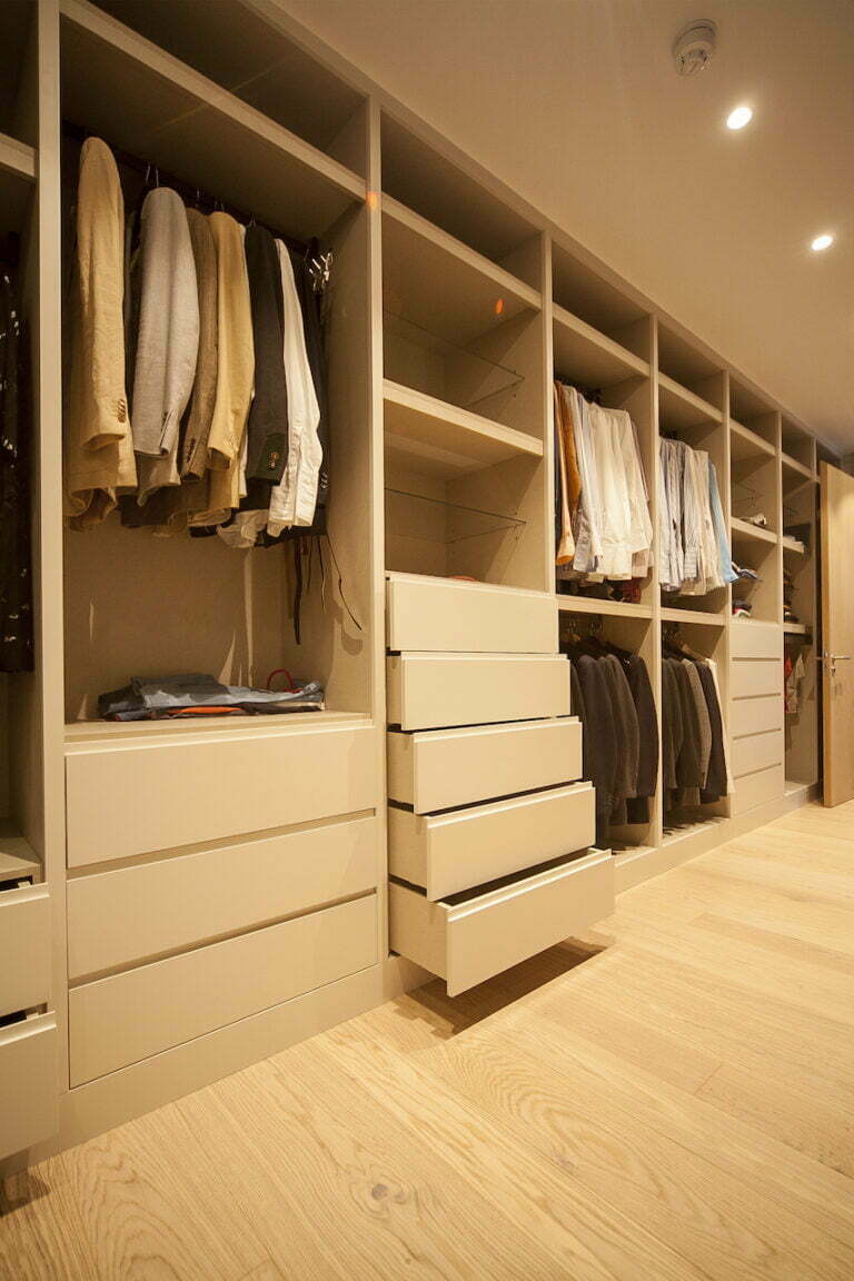 Walk in wardrobe with lacquered drawer fronts, bespoke dressing room London