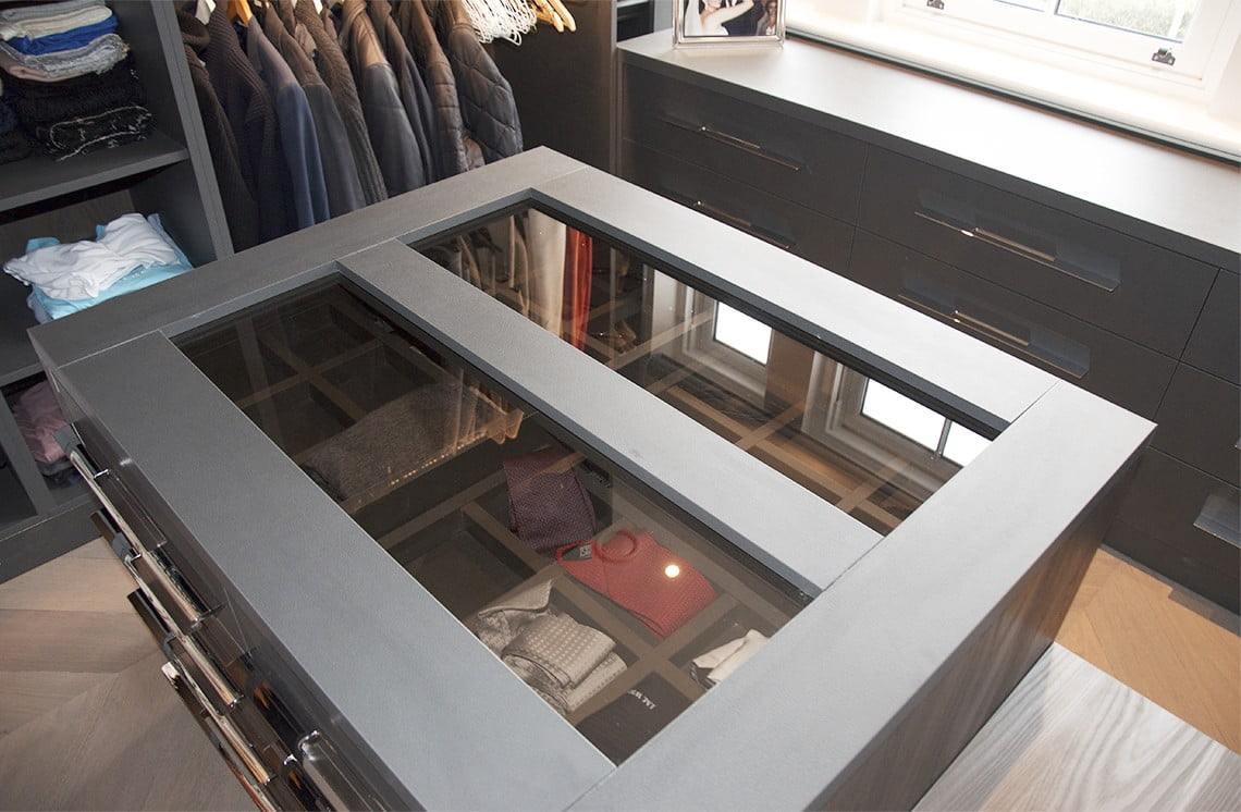 Dark wood walk in wardrobe with leather and LED lighting, London