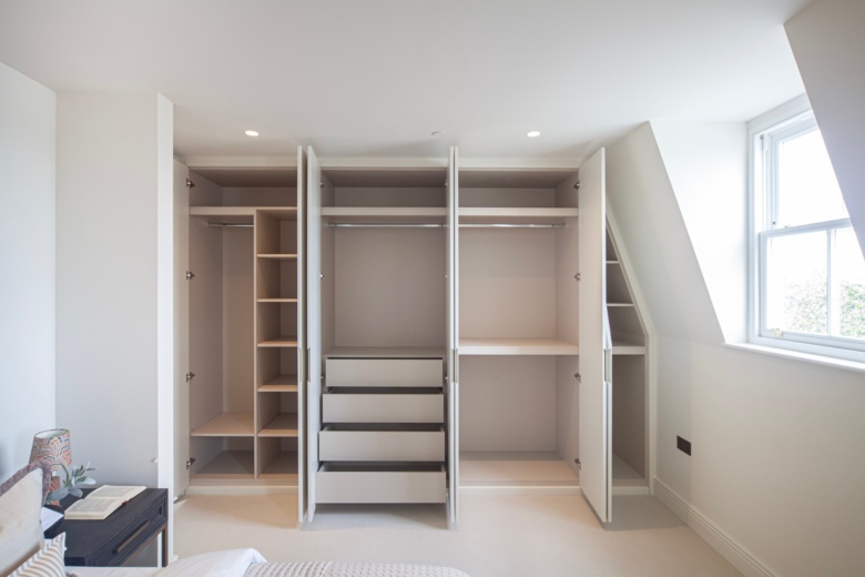 Built in loft room sloping ceiling wardrobe with tongue and groove MDF ...